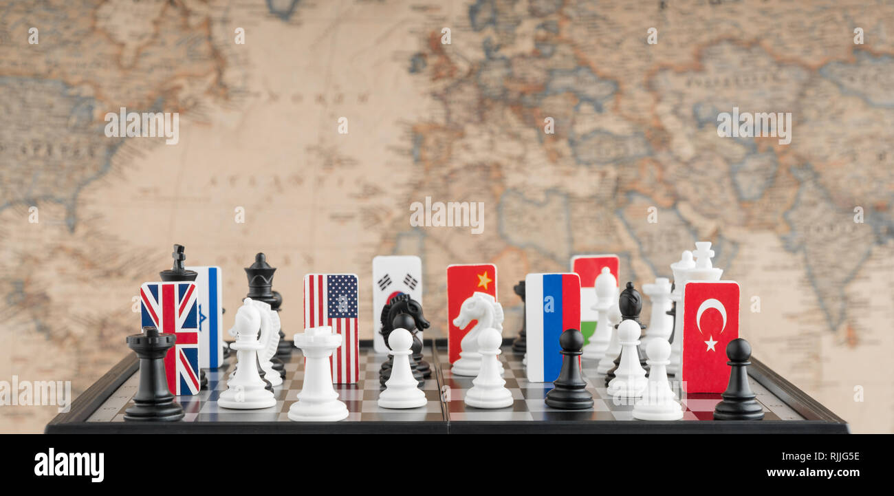 Country flag symbols on the chessboard with figures on the background ...