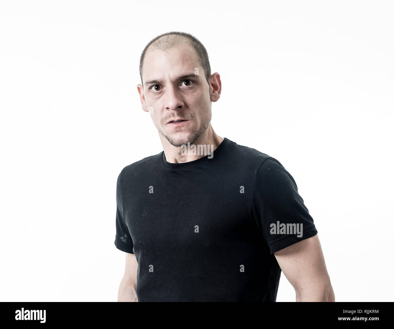 Portrait of angry and upset young man looking furious, aggressive and ...