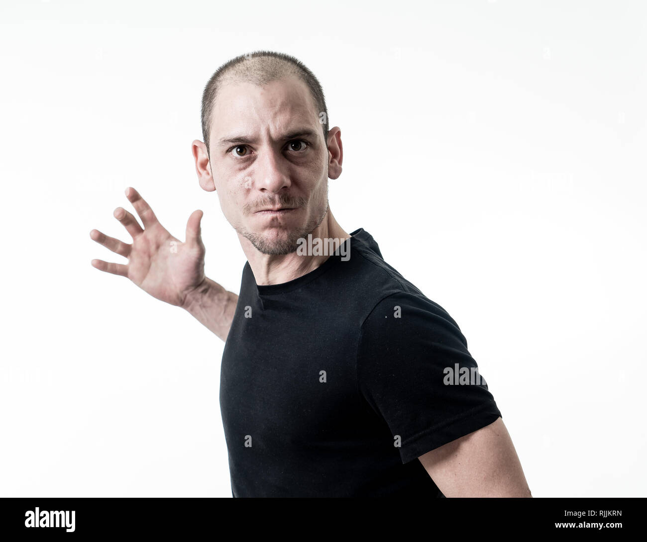 Portrait of angry and upset young man looking furious, aggressive and ...