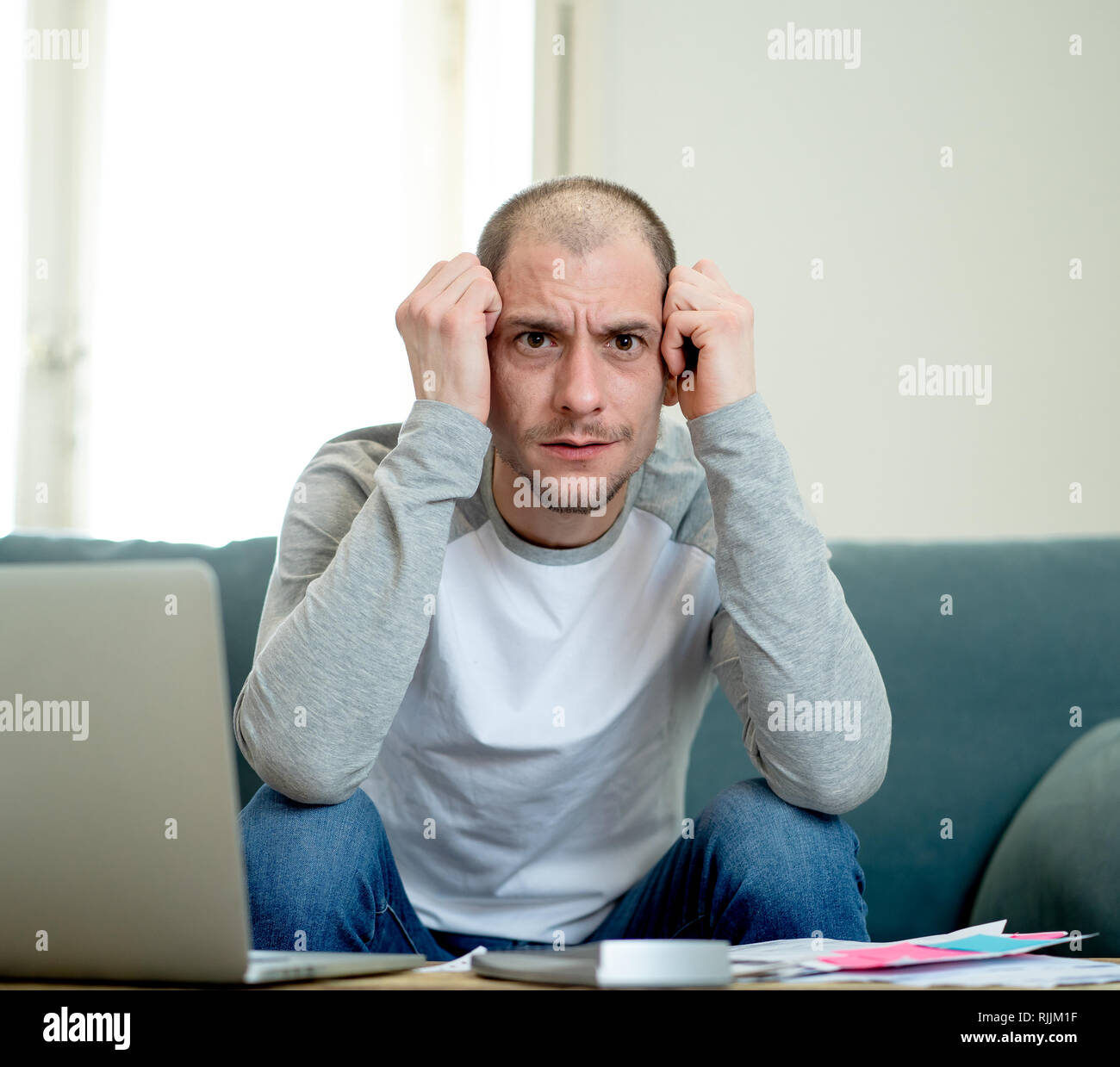 Desperate entrepreneur young man managing finances, reviewing bank ...