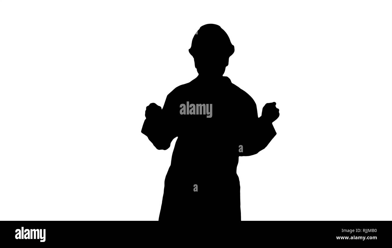 Silhouette Female engineer dancing Stock Photo - Alamy