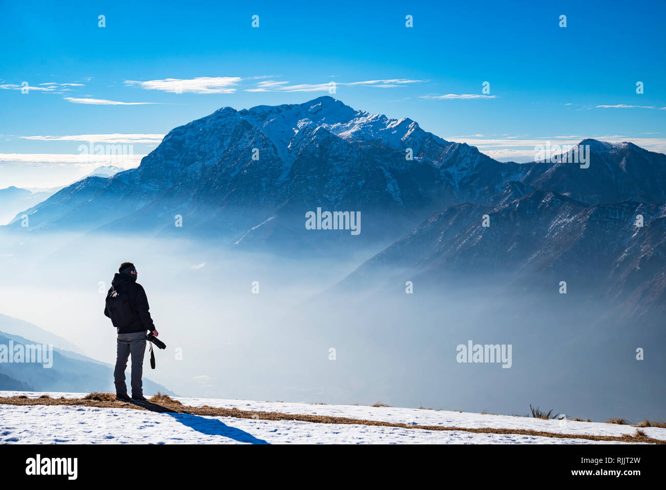 Photographer in the alps Stock Photo - Alamy