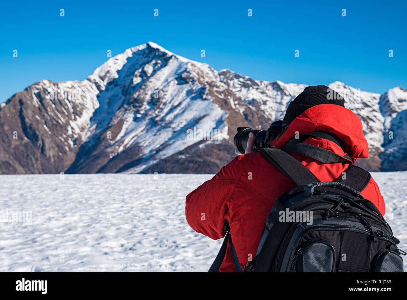 Photographer in the alps Stock Photo - Alamy