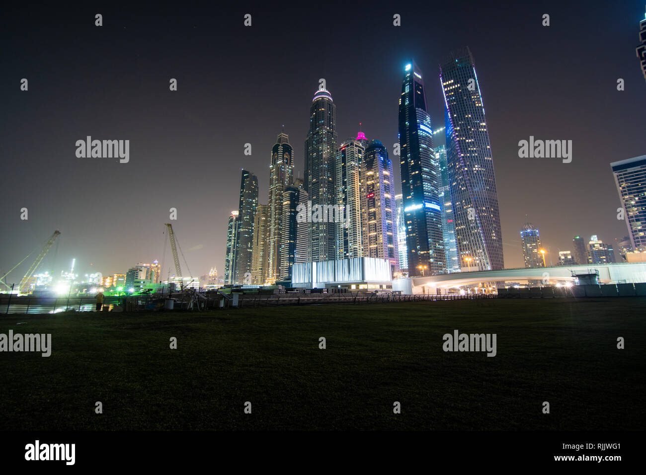 Colorful city lights at night time in Dubai Marina, United Arab ...