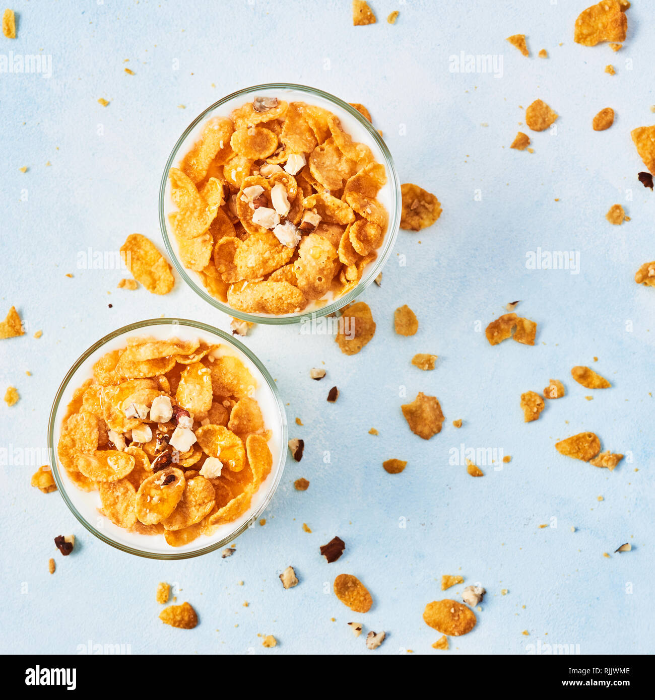 Healthy breakfast or dessert. Tasty corn flakes with yogurt, almond and ...