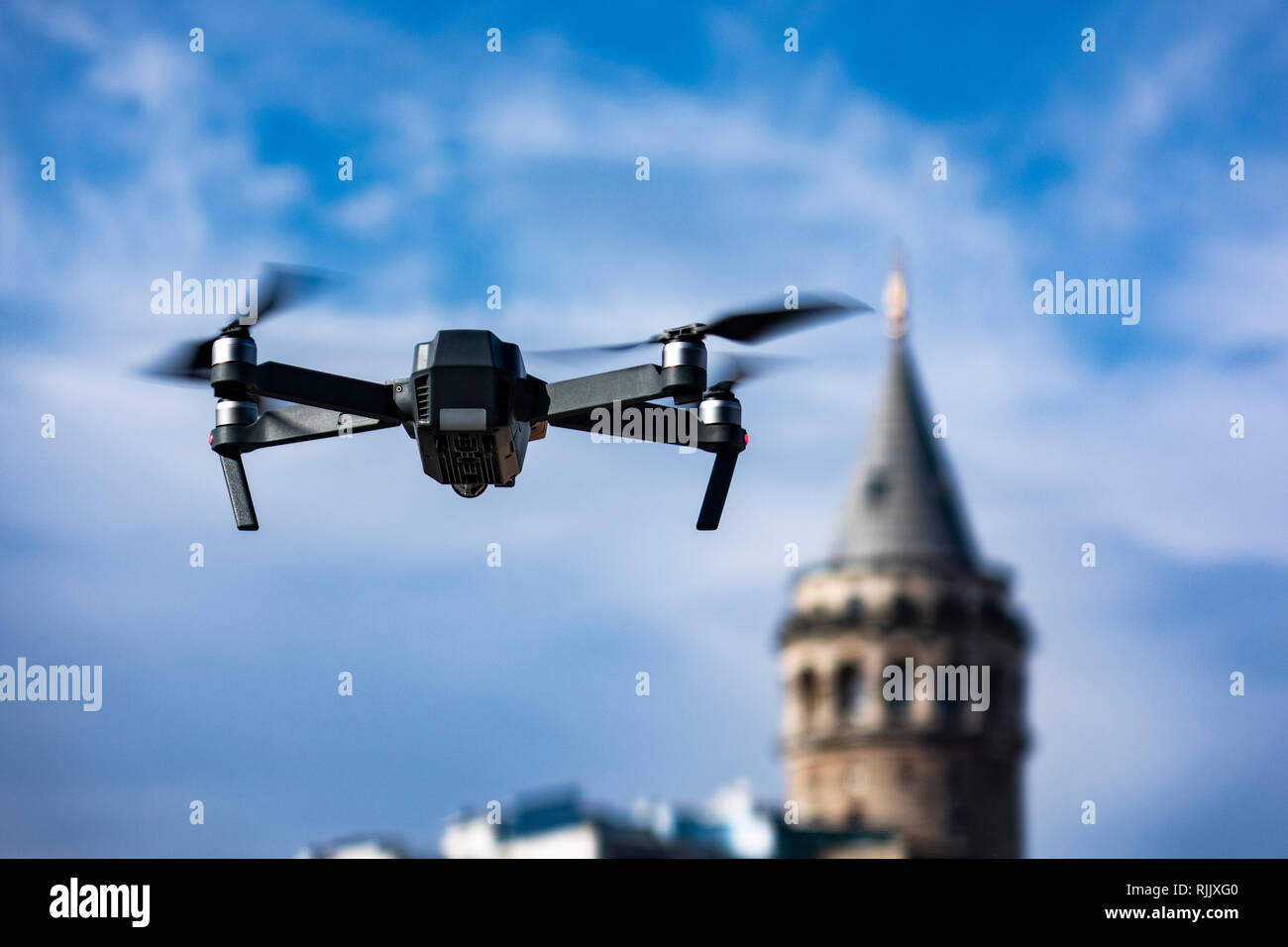 flying drone over galata tower. Using unmanned aerial vehicle (UAV) for ...