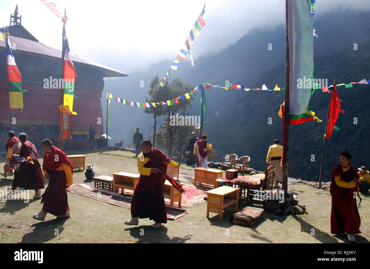 Buddhist monks perform at a ceremony in the Monastery at Olangchung ...
