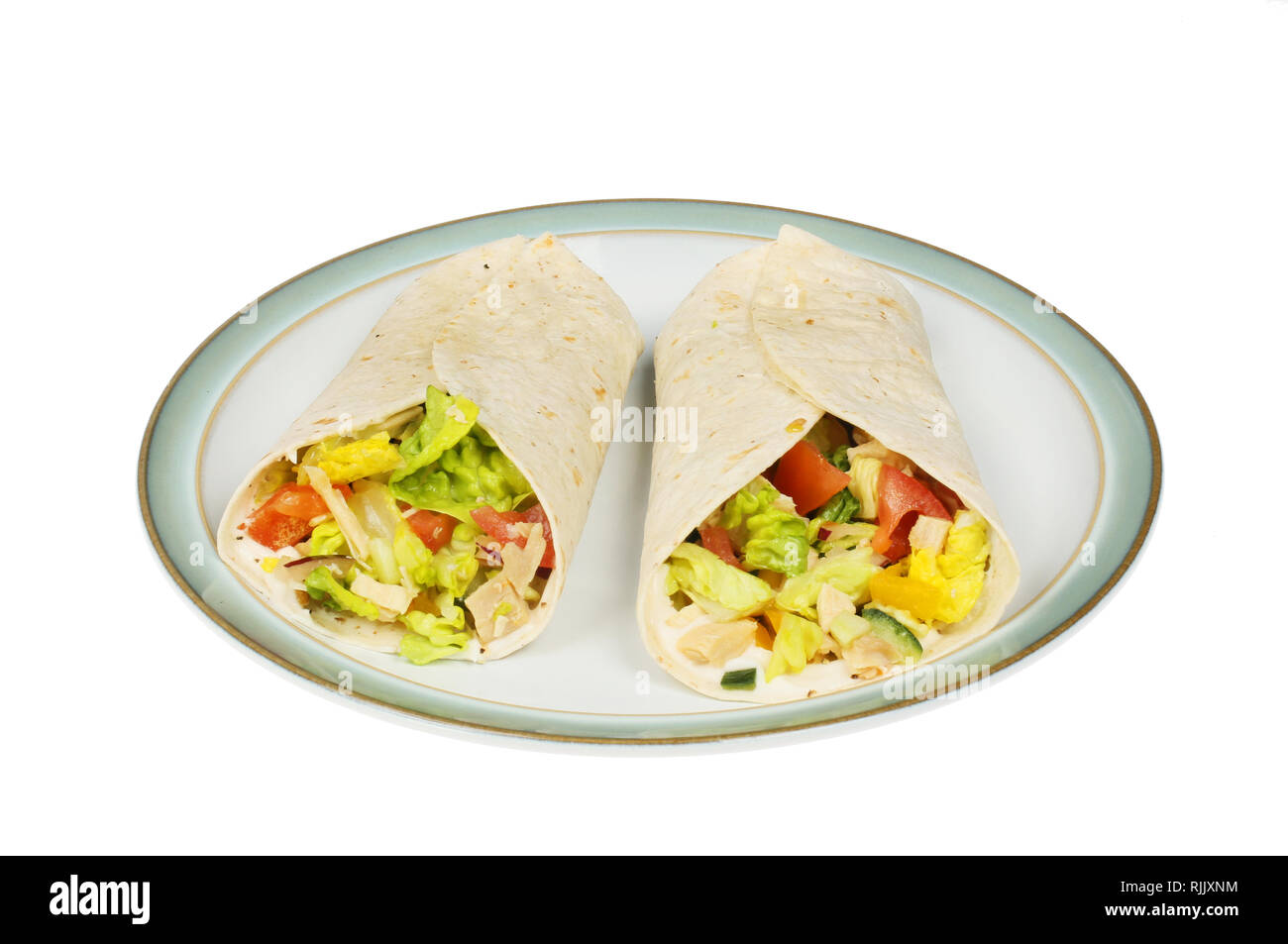 Chicken and salad wraps on a plate isolated against white Stock Photo ...