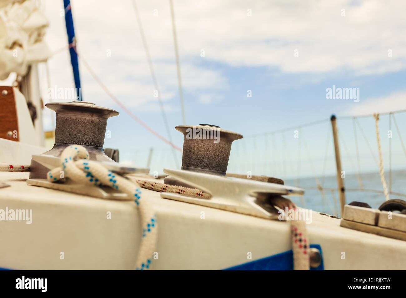 Yacht capstan with rope on sailing boat during cruise, marine objects ...