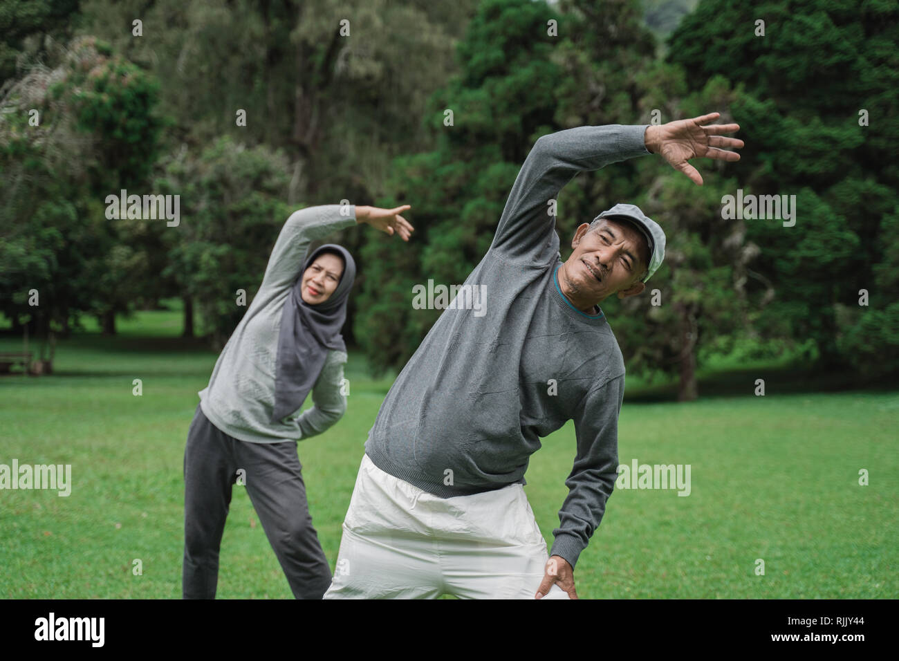 asian muslim senior couple exercising together Stock Photo - Alamy