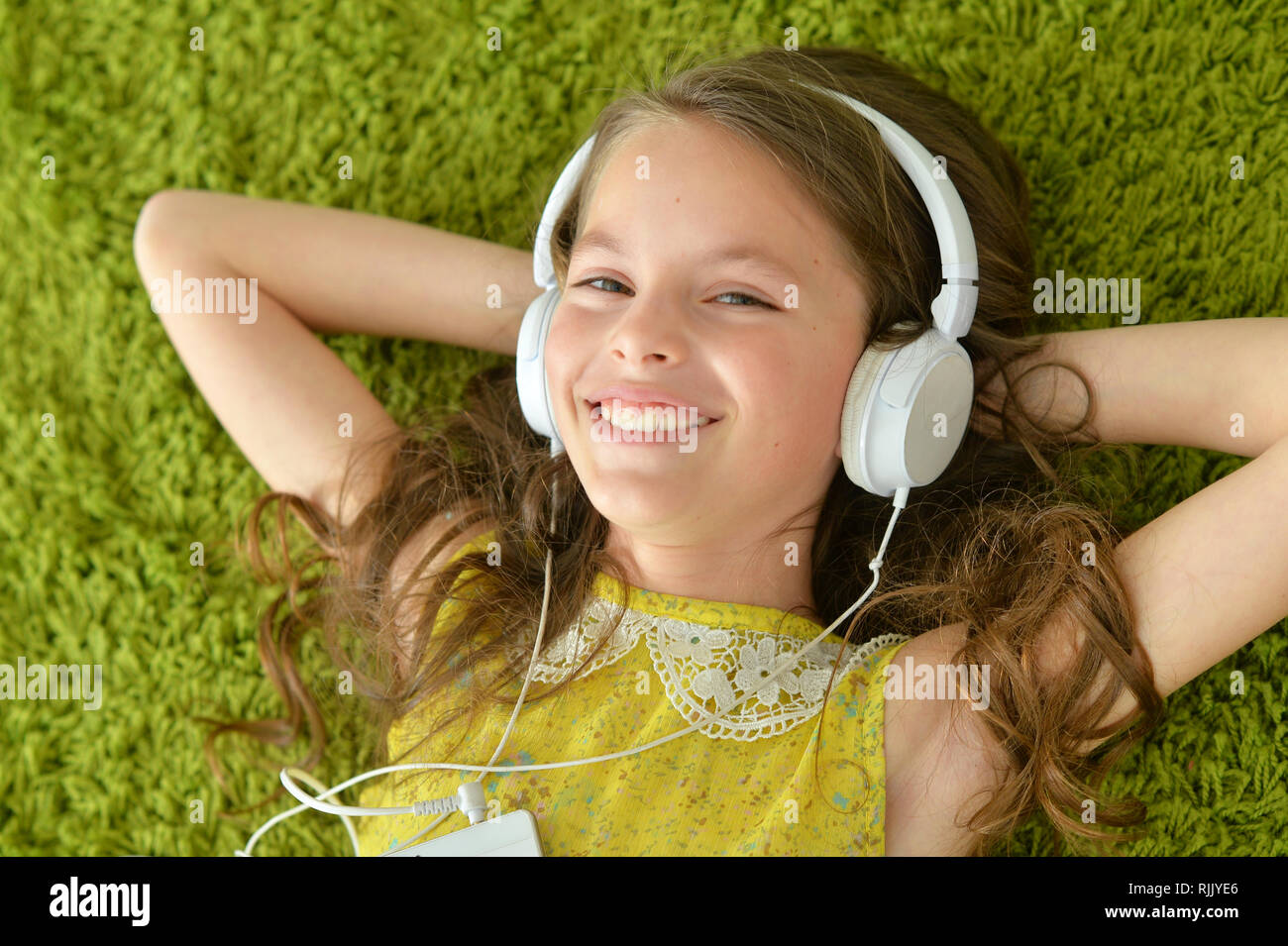 Portrait of cute little girl with headphones Stock Photo - Alamy