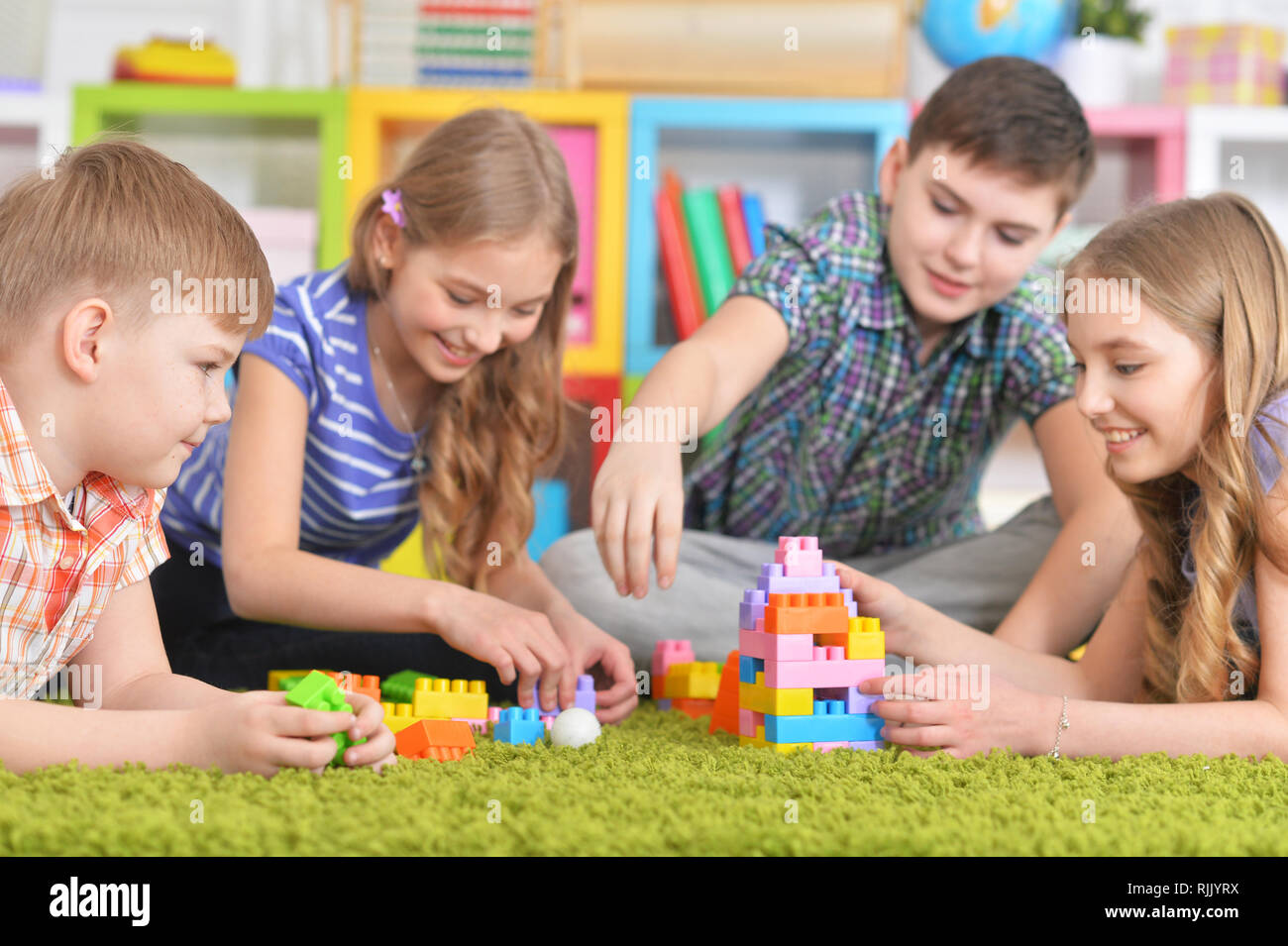 Portrait of group of children playing together Stock Photo - Alamy