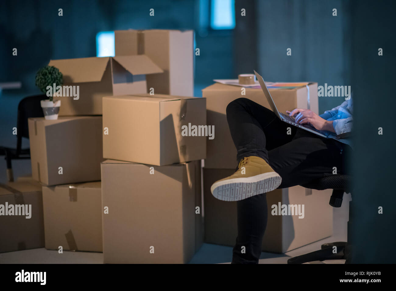 young male architect on construction site checking documents and ...