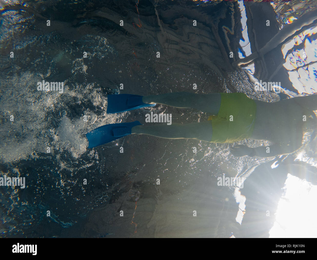 people swimming in pool view from the underwater. sporty lifestyle ...