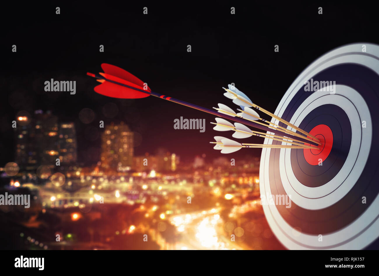 Arrow hit the center of target with modern skyline background. Business target achievement ...