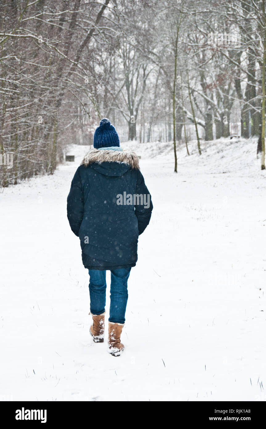 Woman walking alone hi-res stock photography and images - Alamy