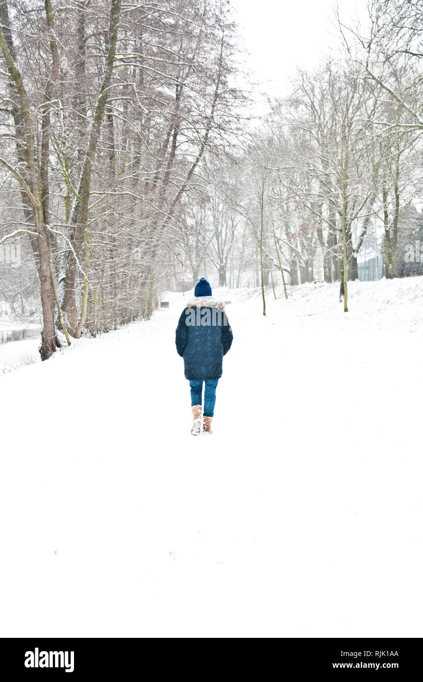 Woman walking alone hi-res stock photography and images - Alamy
