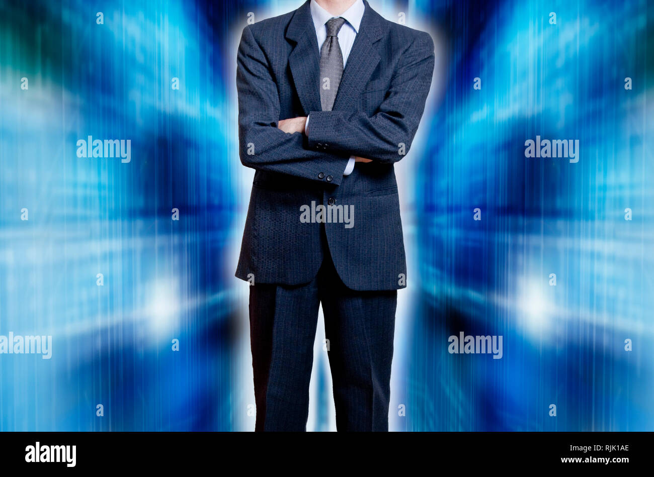 man in suit standing against a dynamic technology background Stock ...