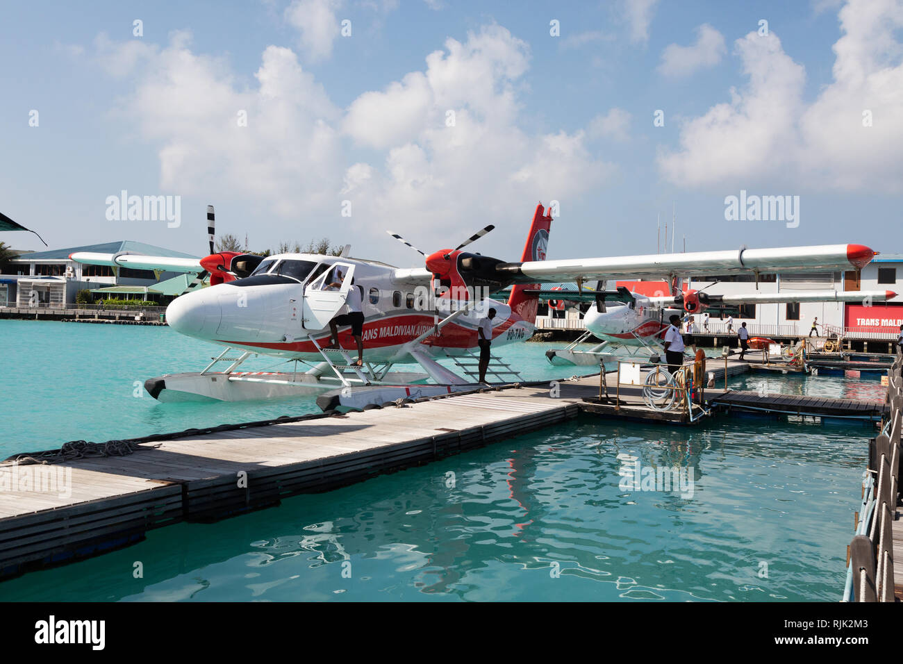 A Trans Maldivian Airways seaplane at its berth , Male Seaplane airport ...