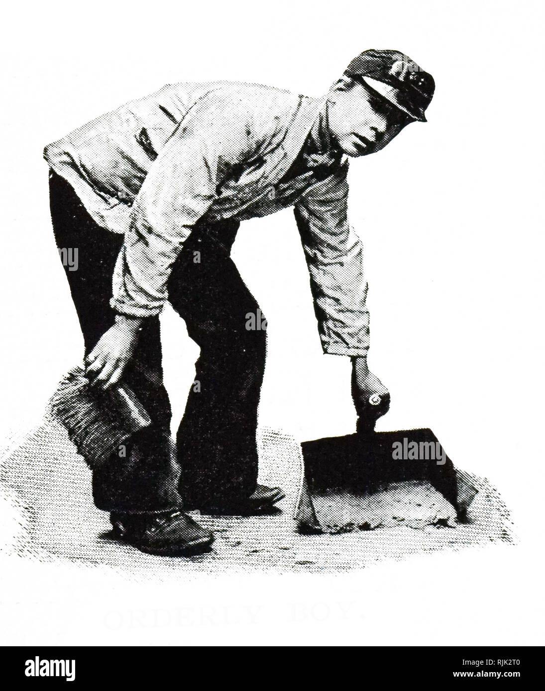 A photograph of a 'street orderly boy' an old name for a street cleaner ...