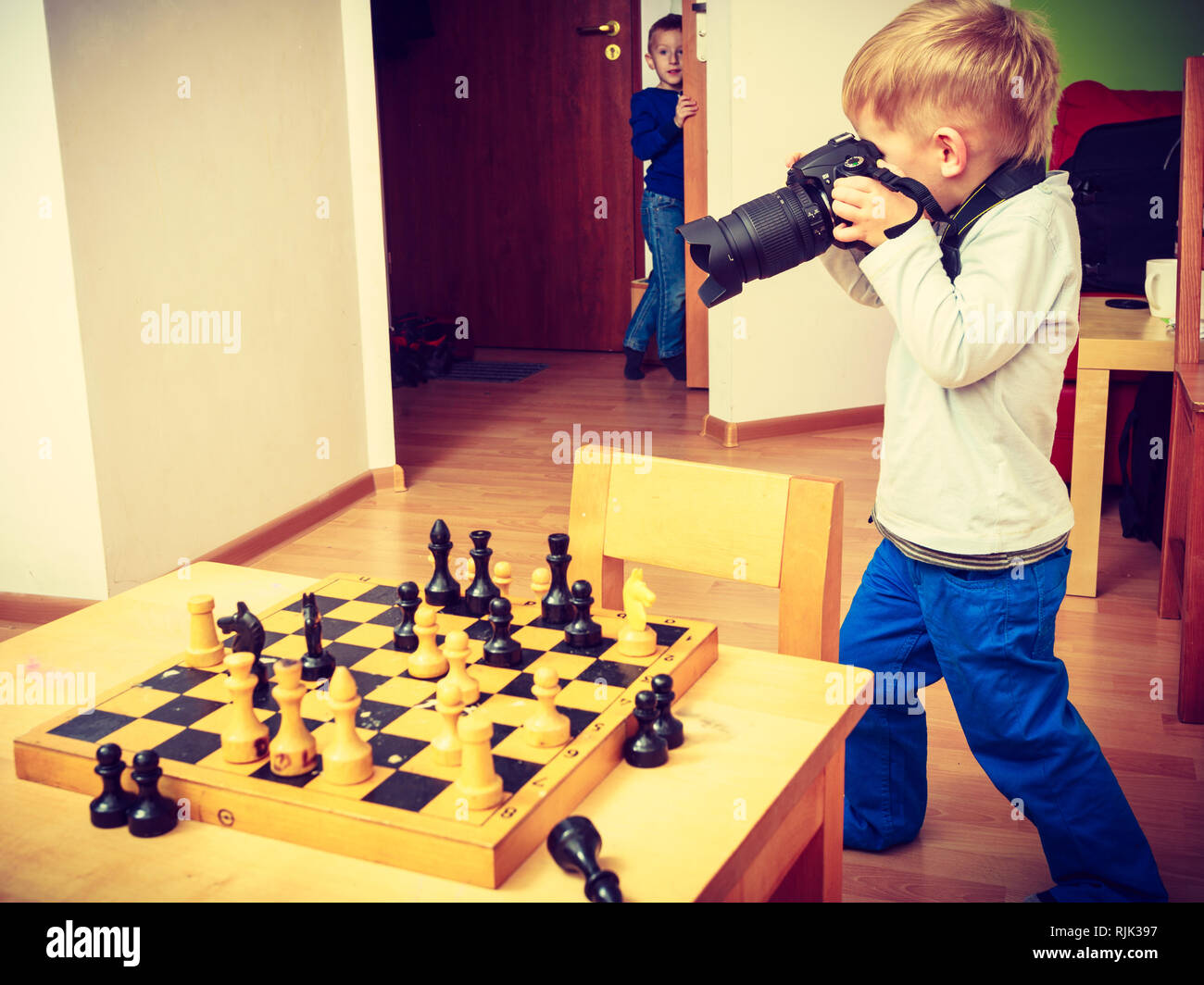 Child passion and hobbies concept. Kid playing with big professional ...