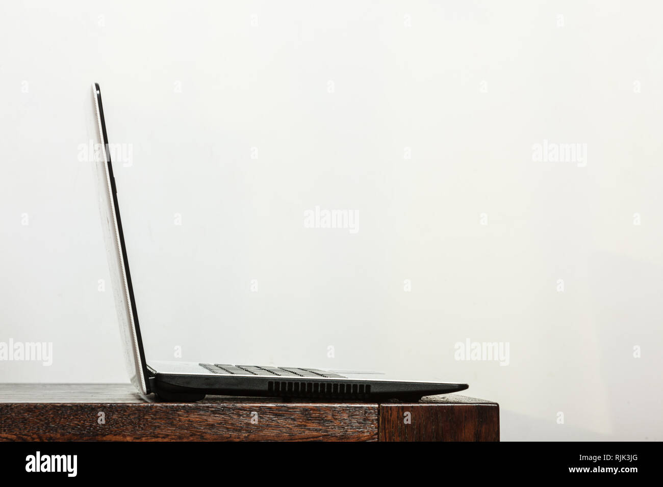 Technology and computers. New future. Laptop stand on table side view ...