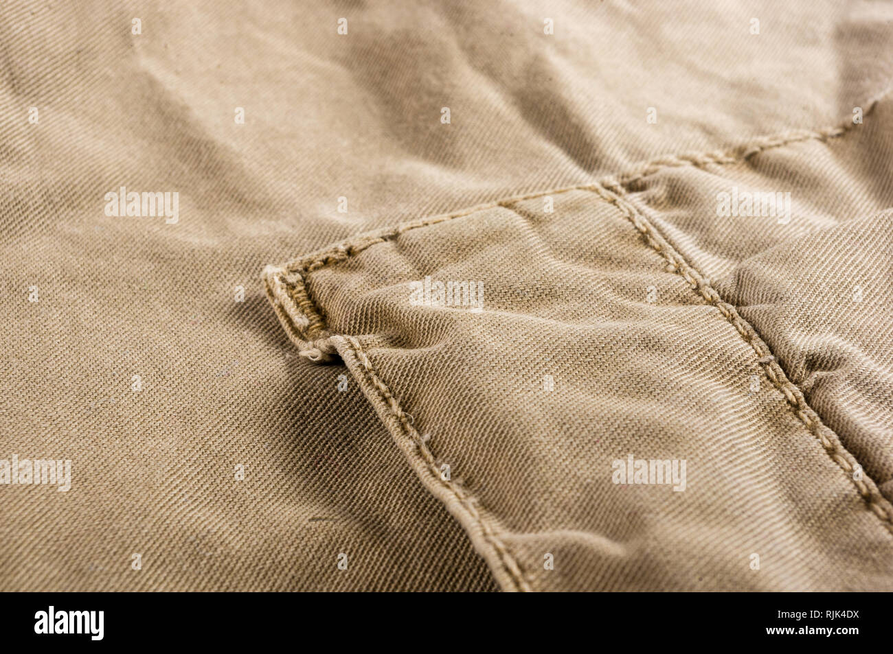 clothing items washed cotton fabric texture with seams, macro, close-up ...
