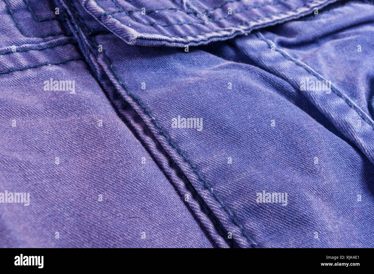 clothing items washed cotton fabric texture with seams, macro, close-up ...