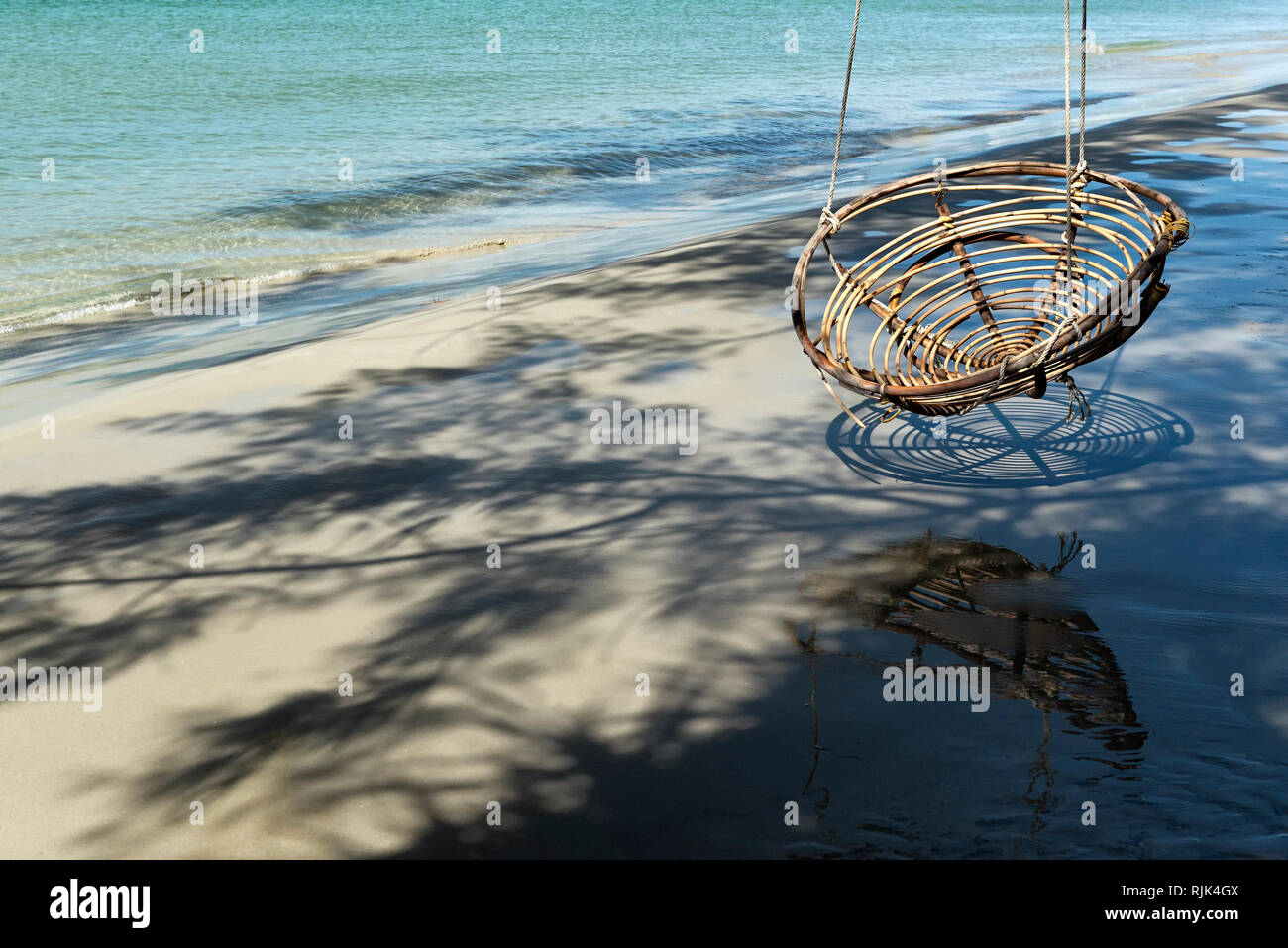 Rustic swing chair on the beach Stock Photo - Alamy