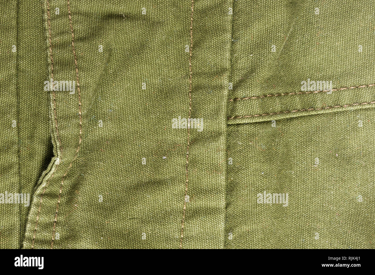 clothing items washed cotton fabric texture with seams, macro, close-up ...
