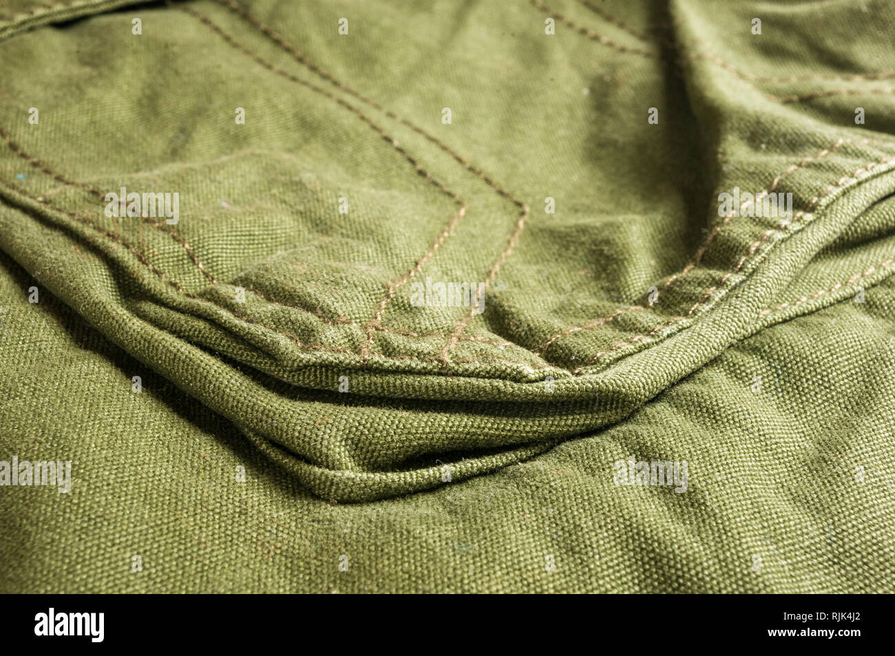 clothing items washed cotton fabric texture with seams, macro, close-up ...