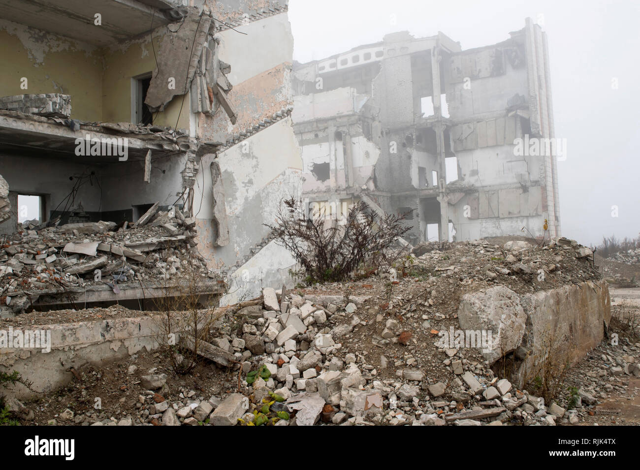 The remains of the destroyed building in the form of piles and a ...