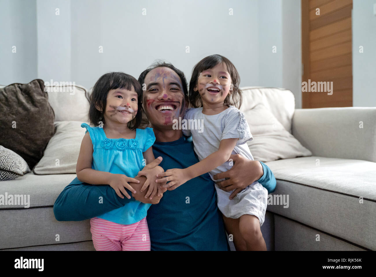 face painting with daddy at home Stock Photo - Alamy