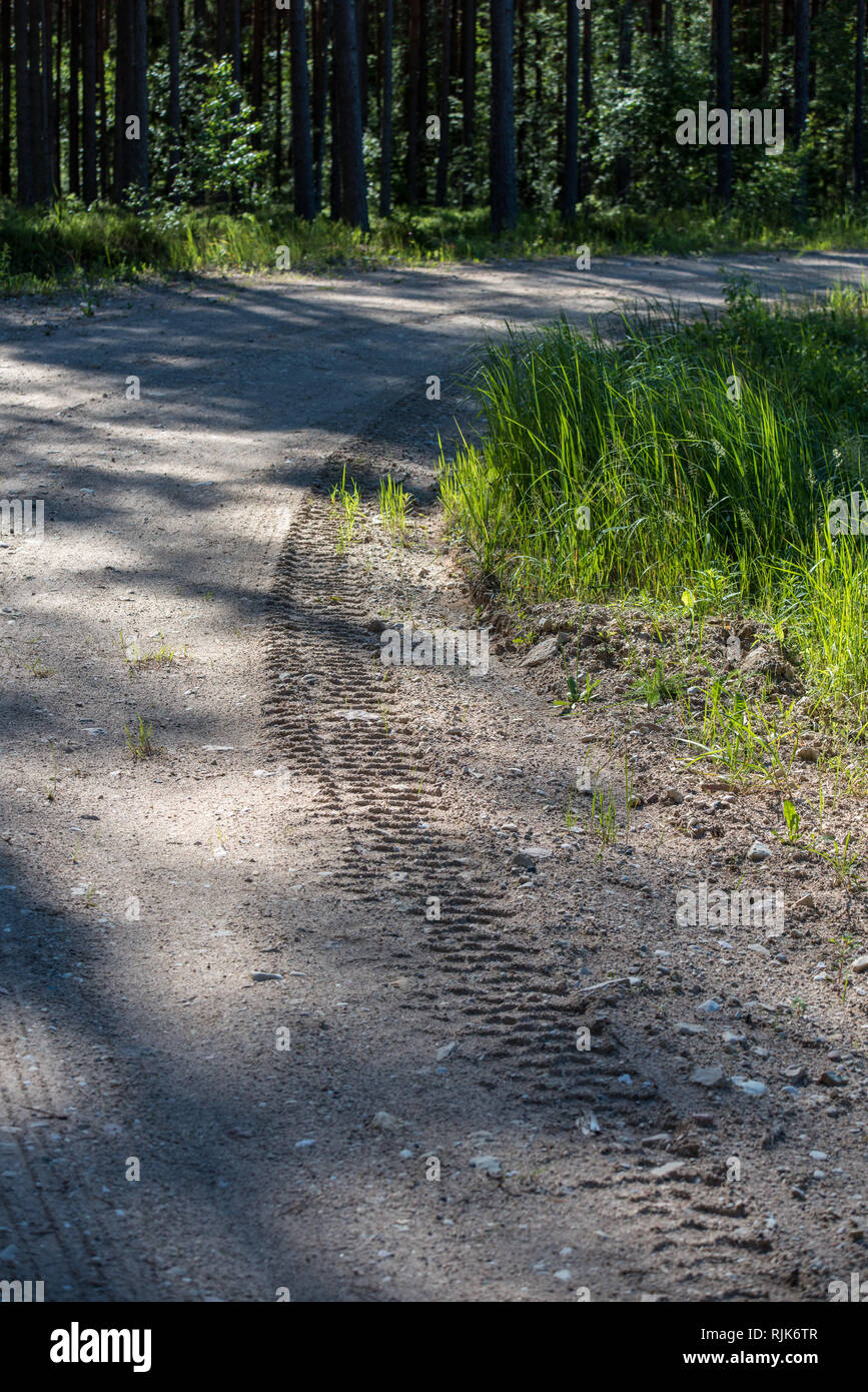 empty country gravel road with mud puddles and bumps. dirty road ...