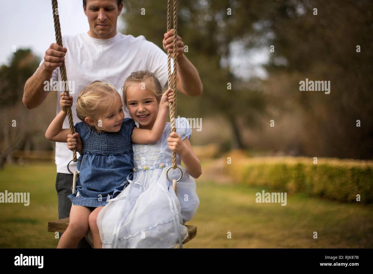 Girls on a rope swing hi-res stock photography and images - Alamy