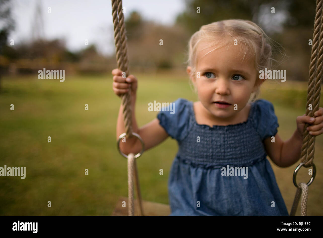 Girls playing swinging swing rope hi-res stock photography and images ...