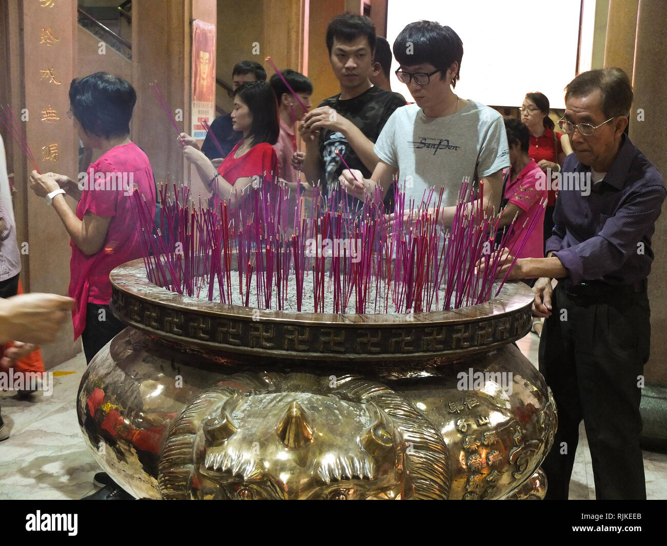 Filipino Chinese are seen lighting their incense during the Chinese New ...