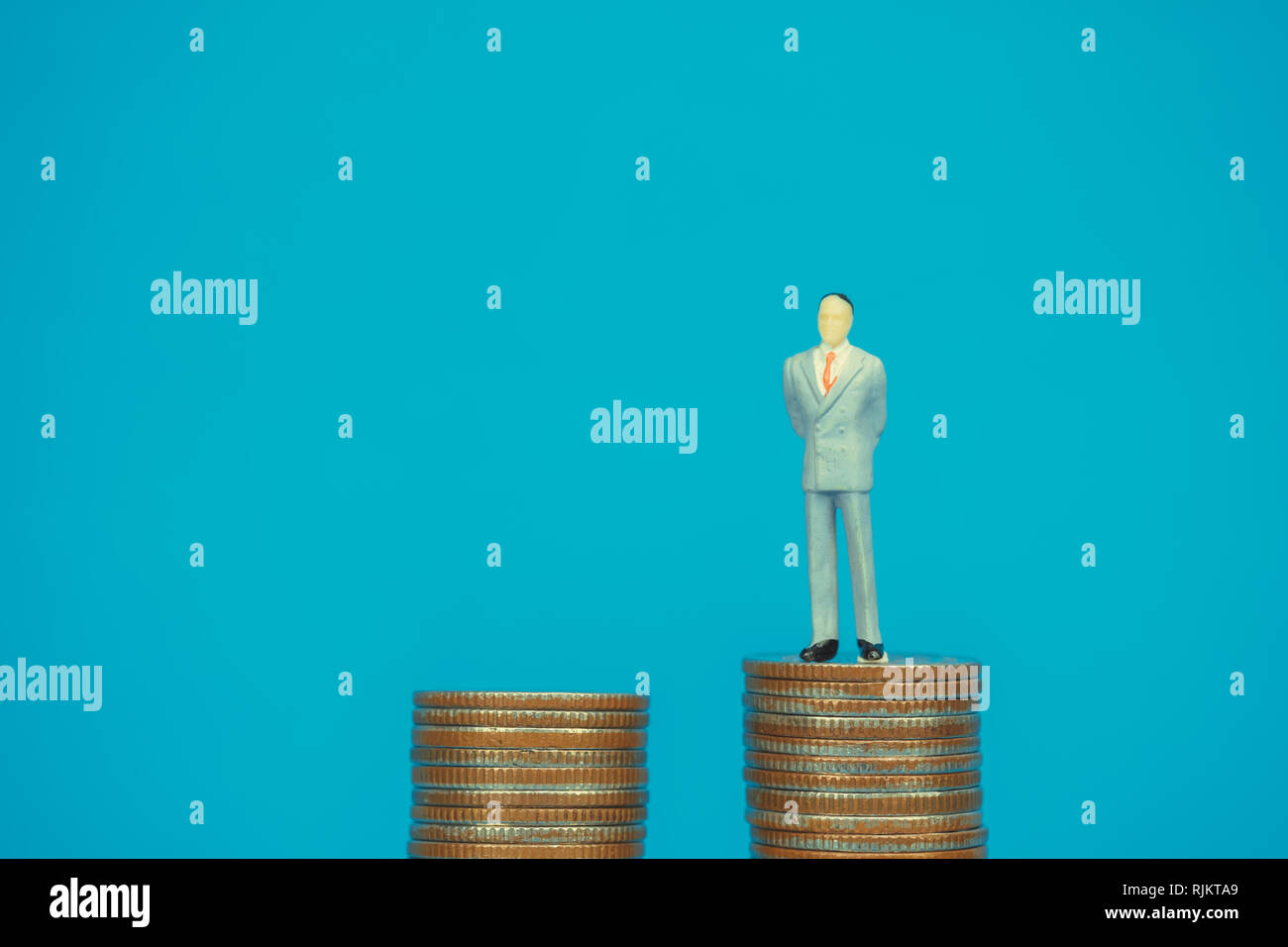 Figure miniature businessman or small people investor and office worker ...