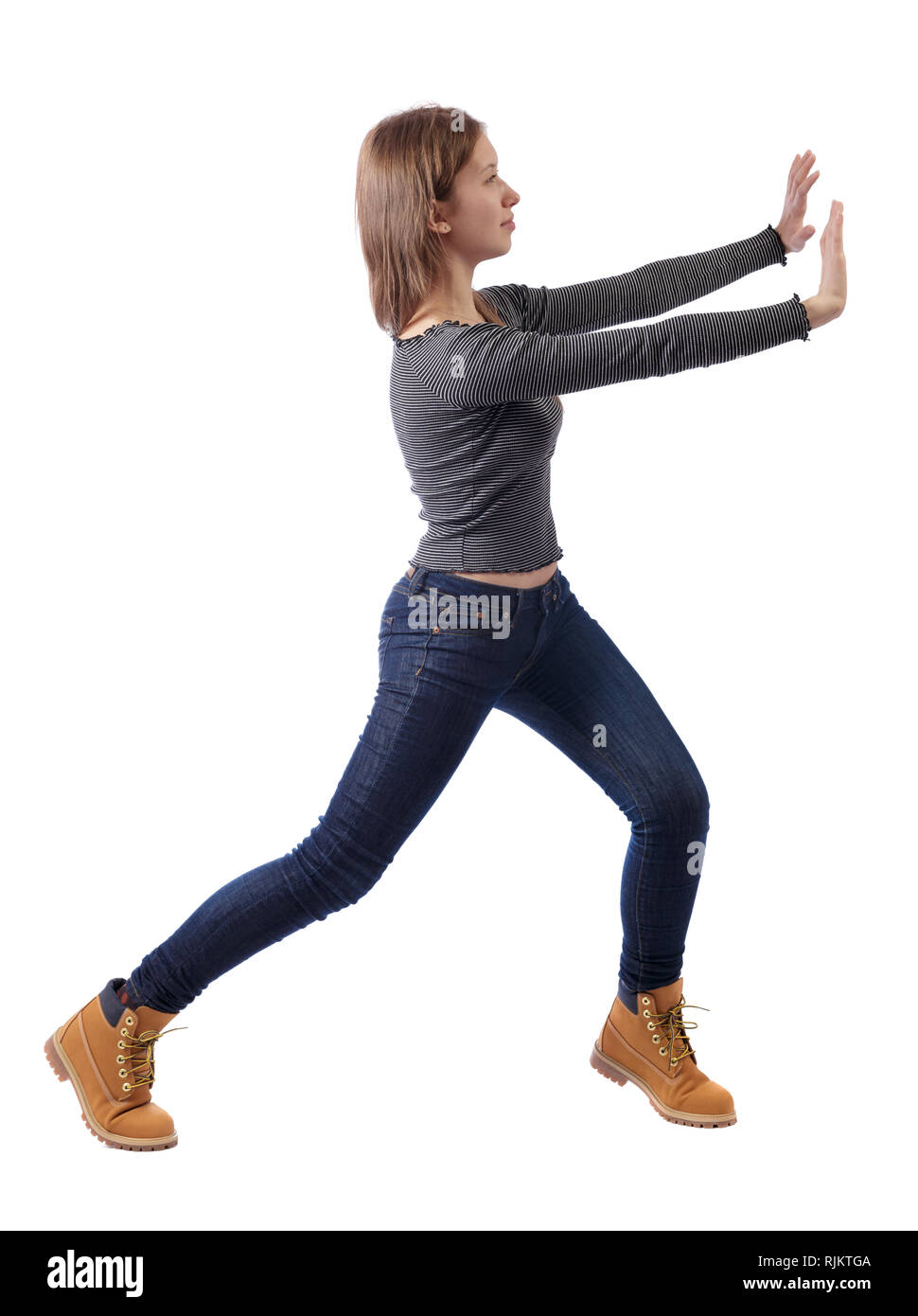 back view of woman pushes wall. Isolated over white background. Rear ...