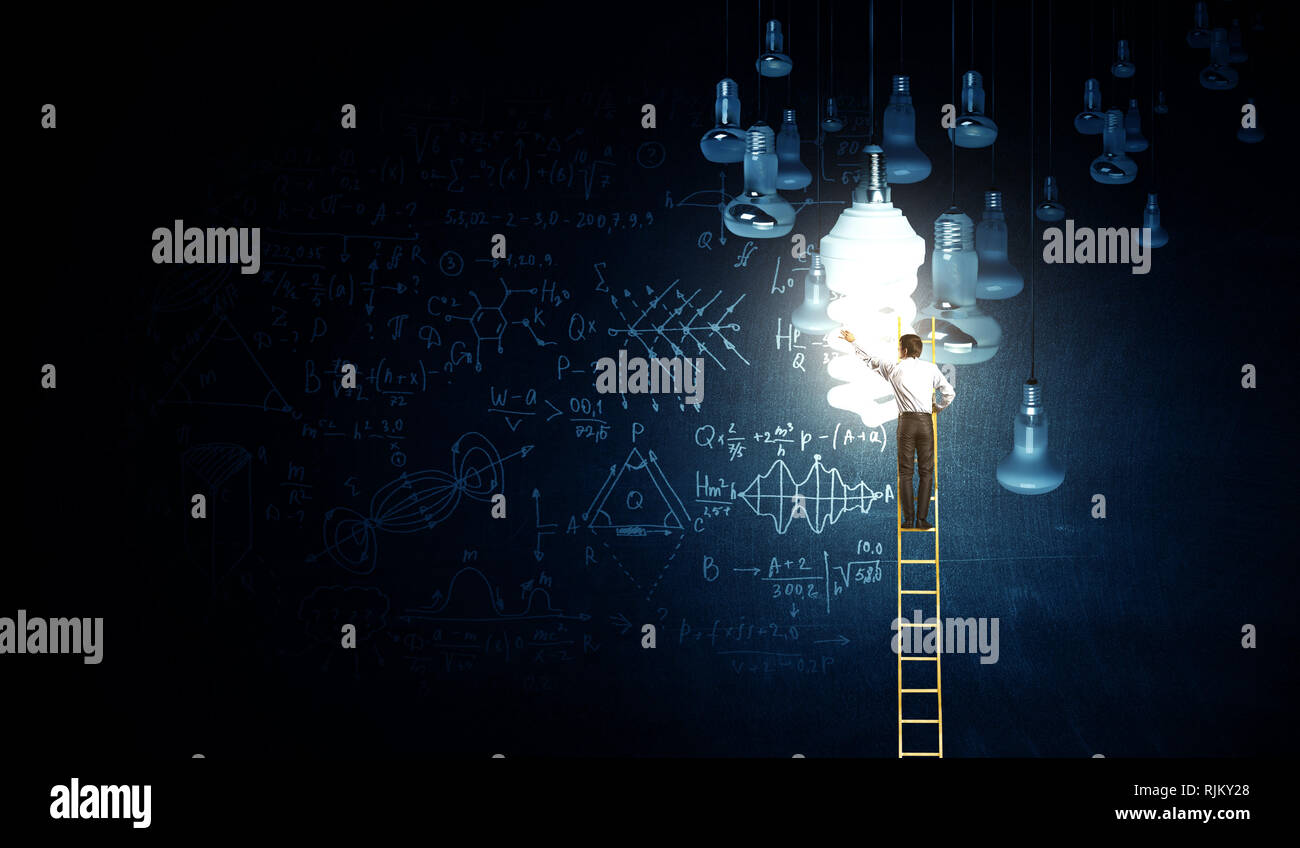 Man standing on ladder reaching hi-res stock photography and images - Alamy