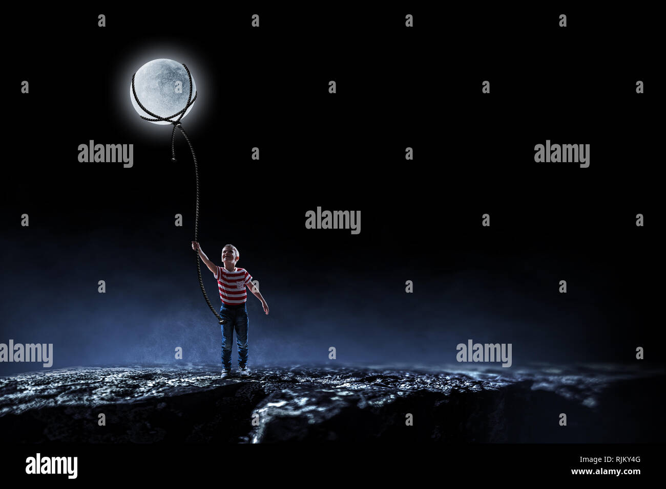Kid boy flying at night on moon balloon . Mixed media Stock Photo - Alamy