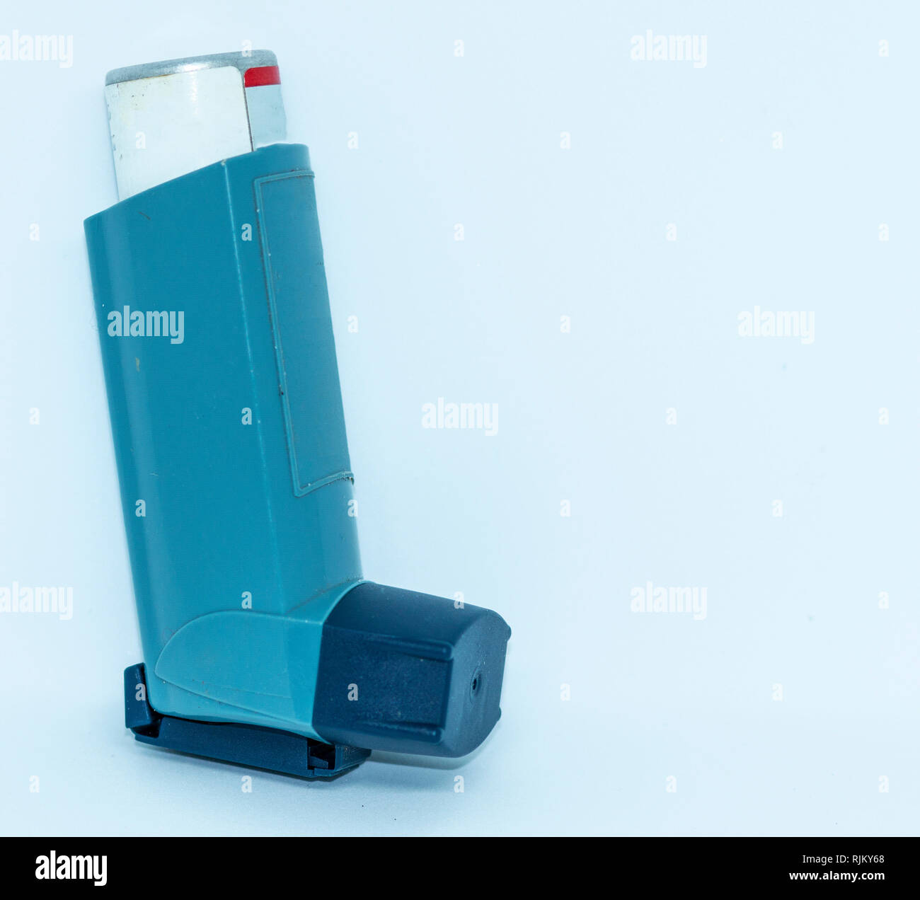 One inhaler standing in front of white background with room for ...