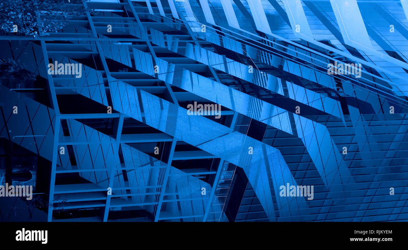 Bottom angle view of glass blue building Stock Photo - Alamy