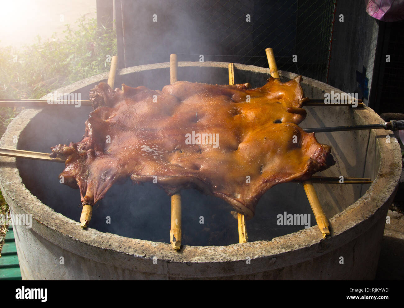 Grill the pig with a grilling on the grill. Grilled traditional coal ...