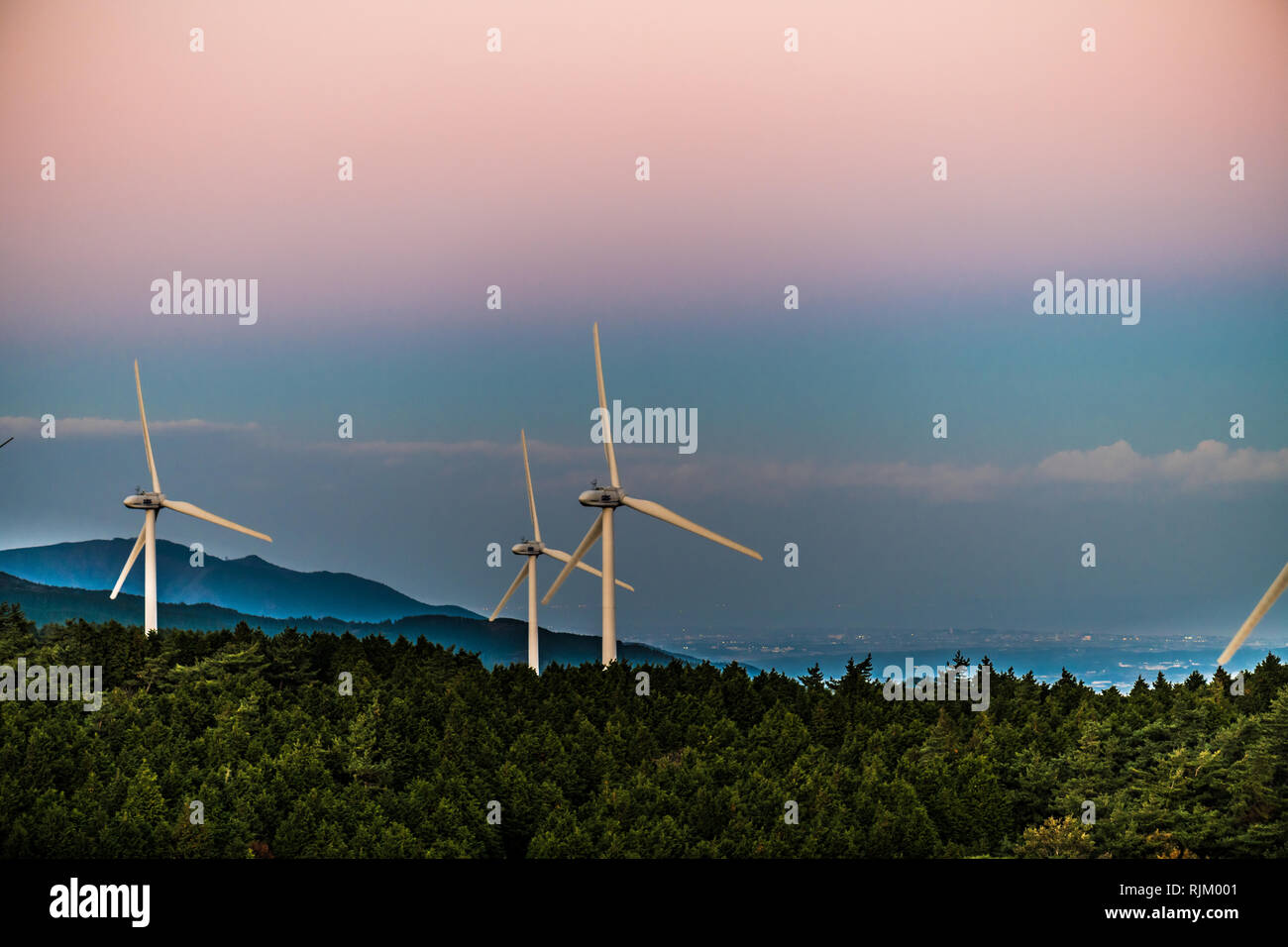 Twilight time. The wind power generators standing at the hilltop ...