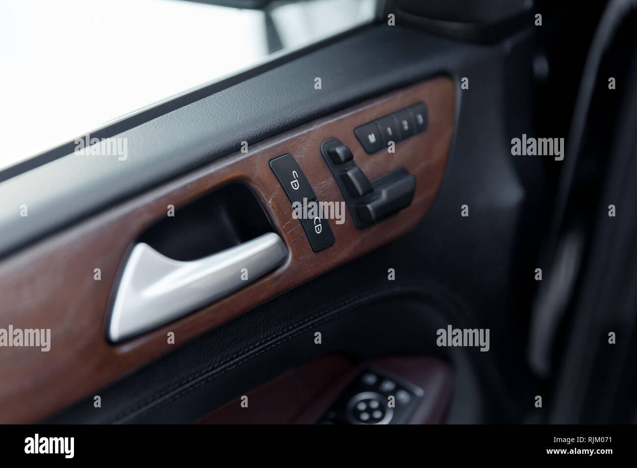 Door panel with power window controller. Detail of the car interior ...