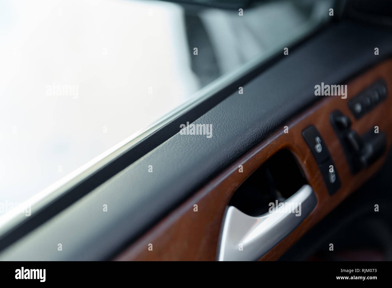 Door panel with power window controller. Detail of the car interior ...