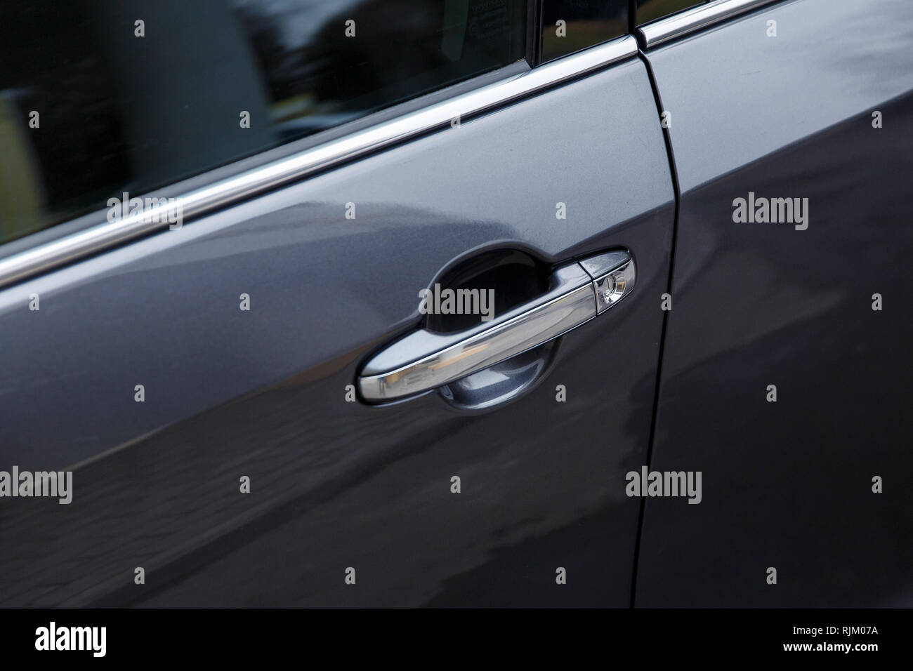 Door of a black car. Glossy coating Stock Photo - Alamy