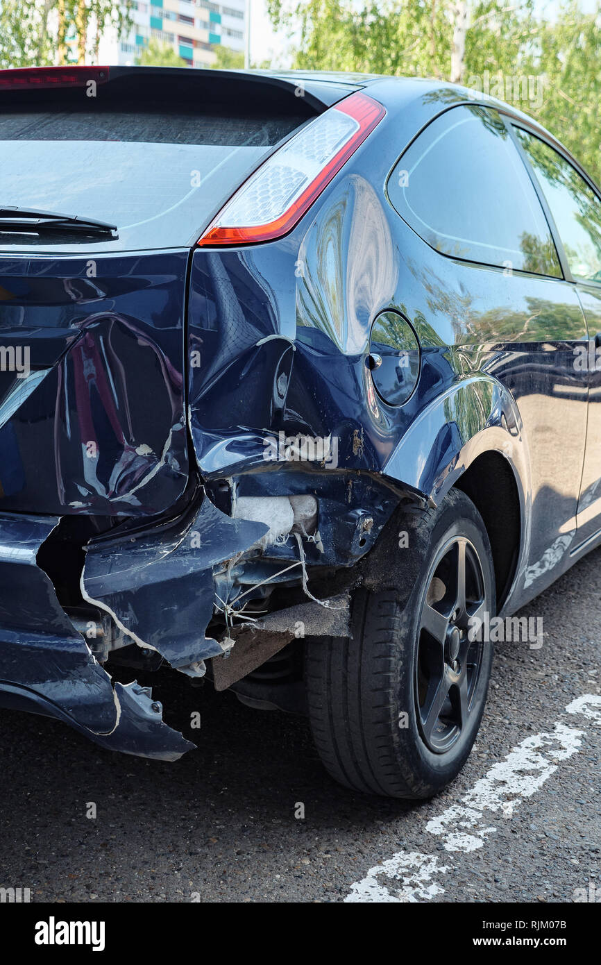 Blue car with a broken rear hood Stock Photo - Alamy