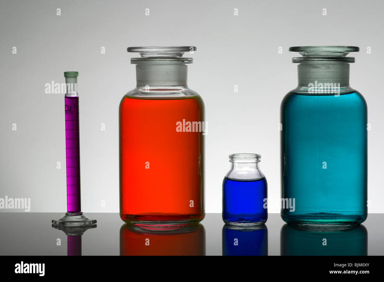 Liquid in laboratory bottles. Scientific biochemical laboratory ...